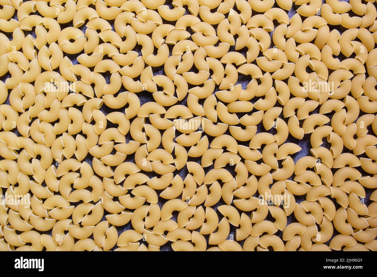 Raw whole dried ridged elbow macaroni pasta Stock Photo - Alamy