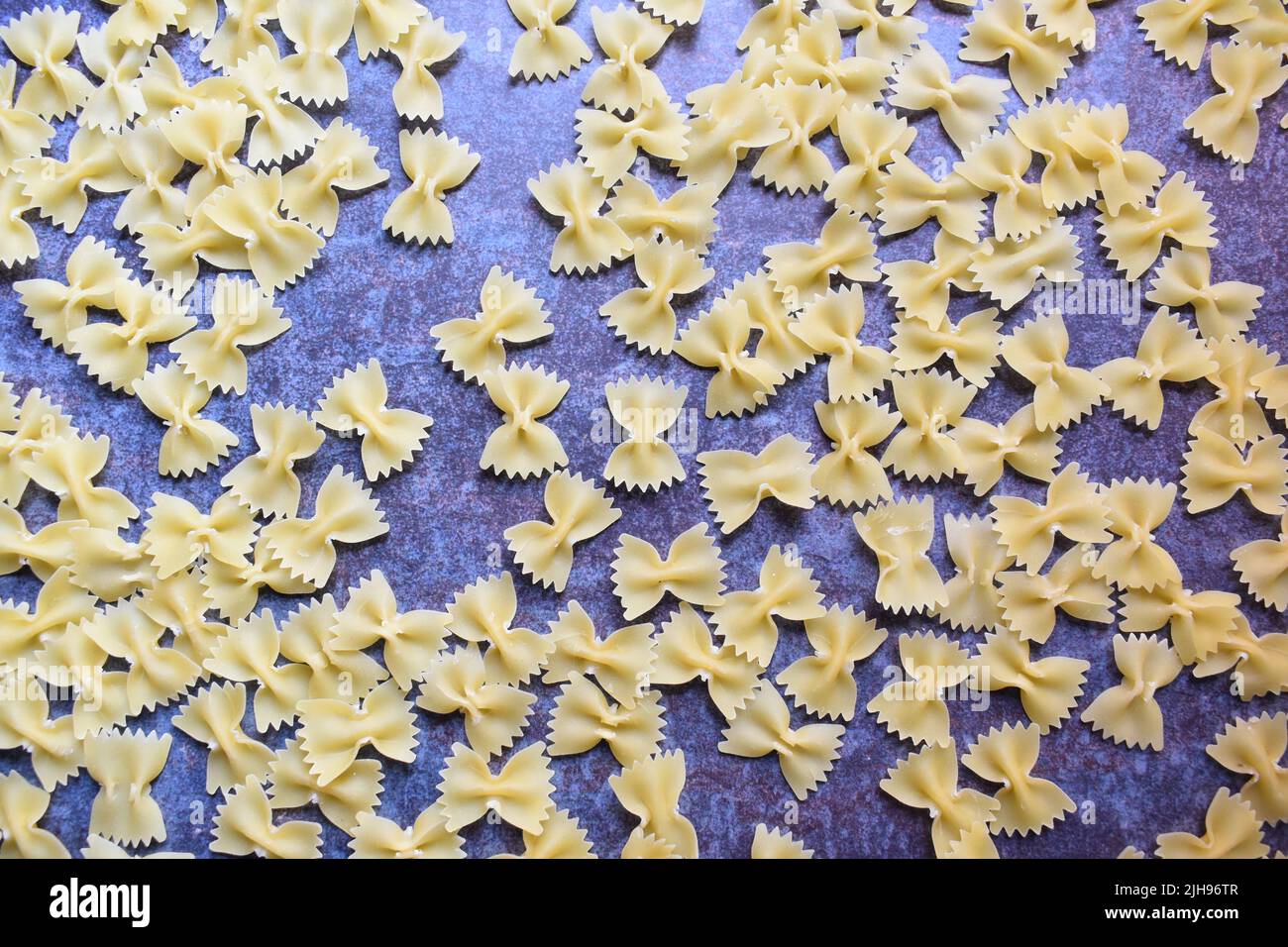 Raw whole dry Bow tie pasta Stock Photo - Alamy