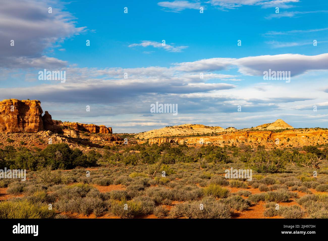 Desert landscape of mesas and rock formations with sagebrush, pinyon ...