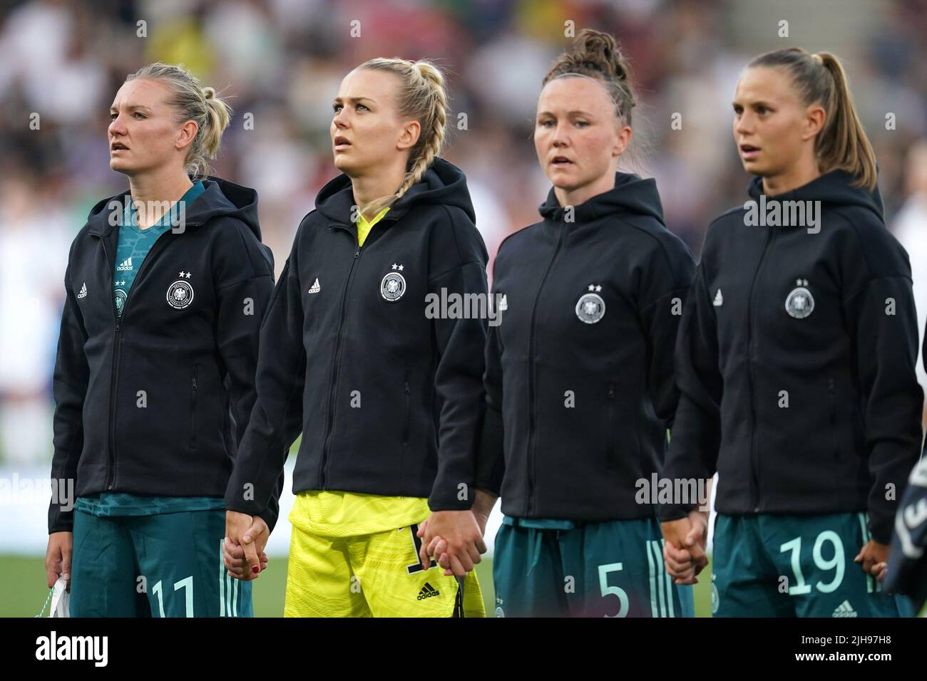 Germany's goalkeeper Merle Frohms (centre-left) singing the German ...