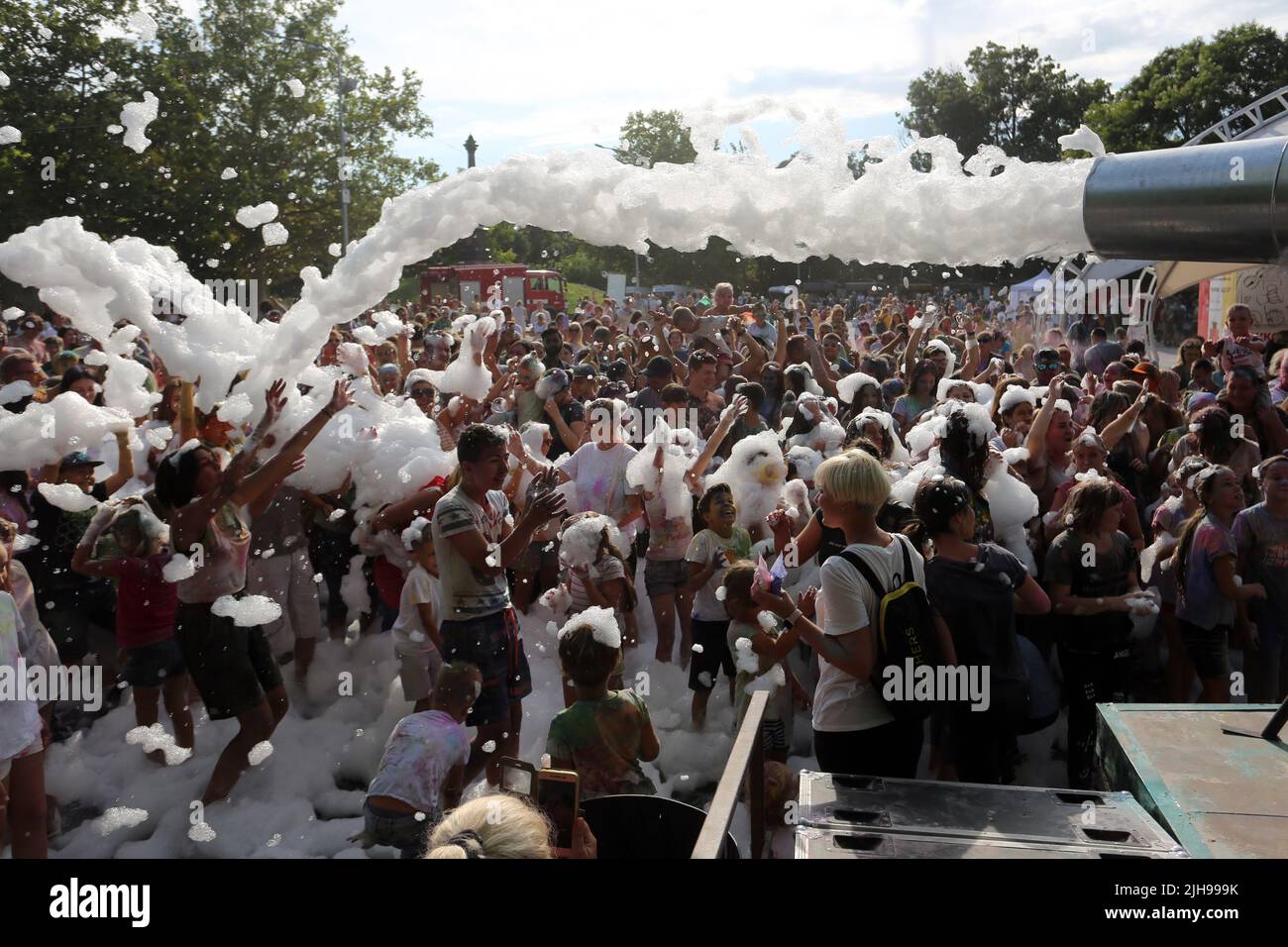 People covered in foam seen dancing during the event. As a holiday ...