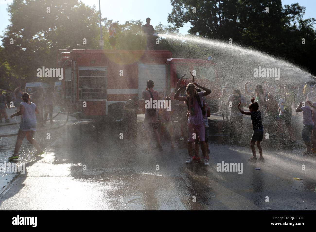 Truck sprays water on man hi-res stock photography and images - Alamy
