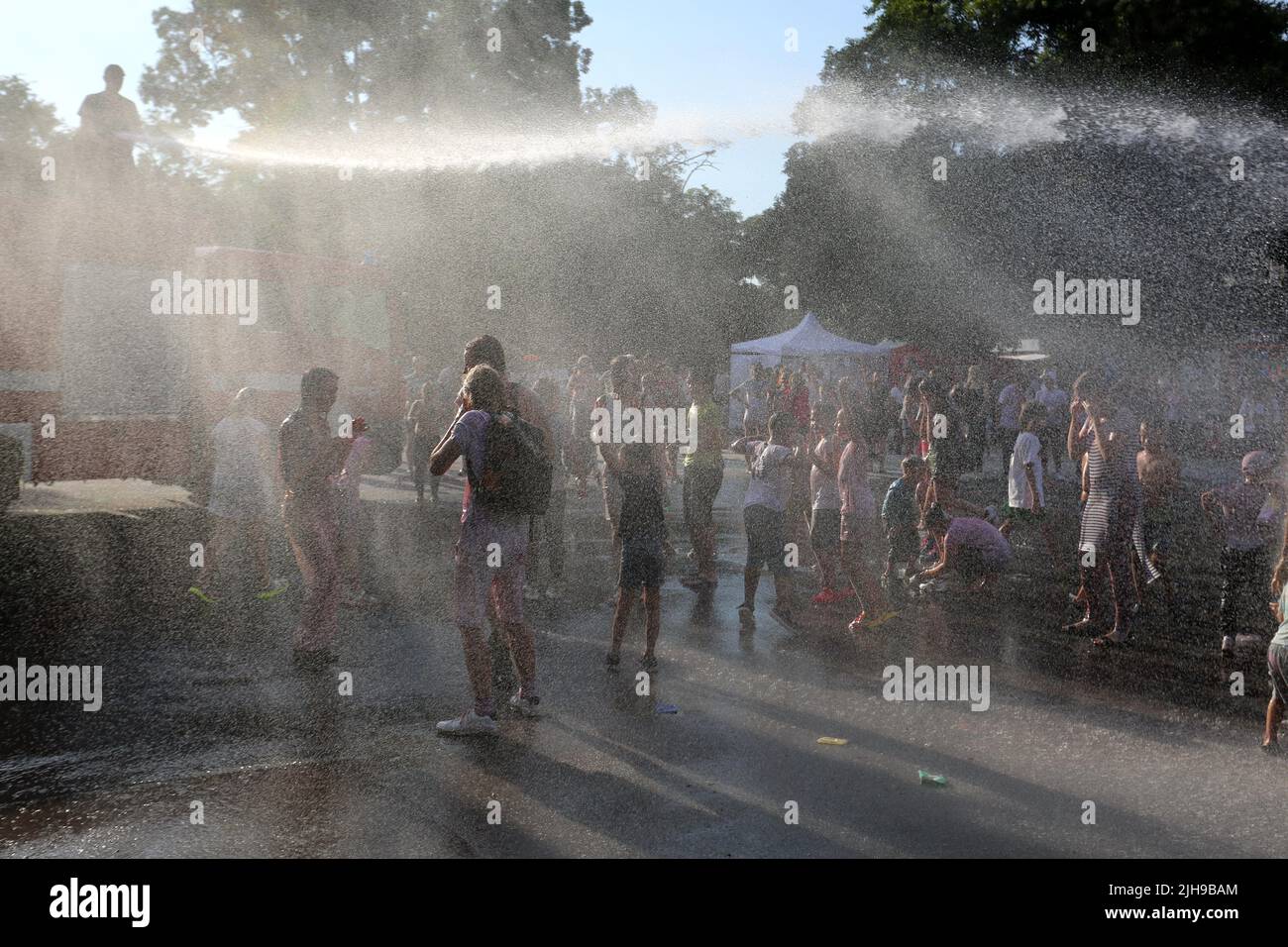 Truck sprays water on man hi-res stock photography and images - Alamy