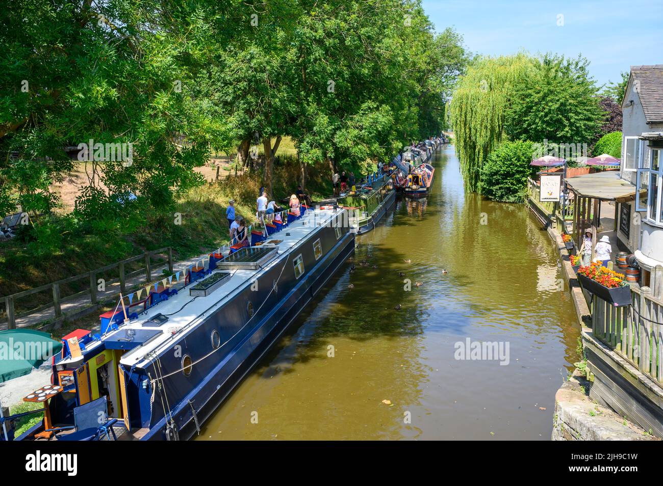 Visitors enjoying a canal festival in the village of Gnosall in ...