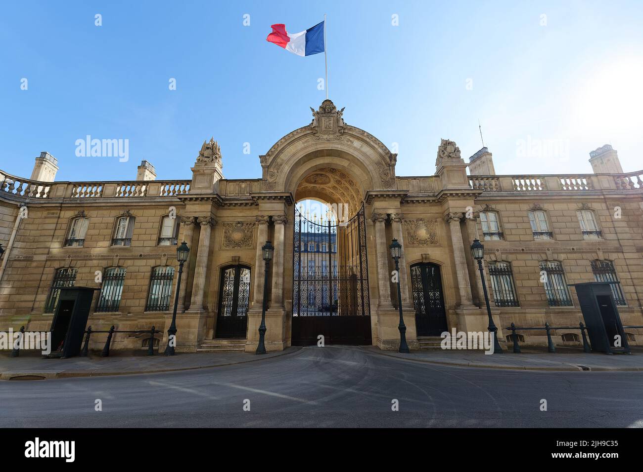 View of entrance gate of the Elysee Palace decorated with national ...