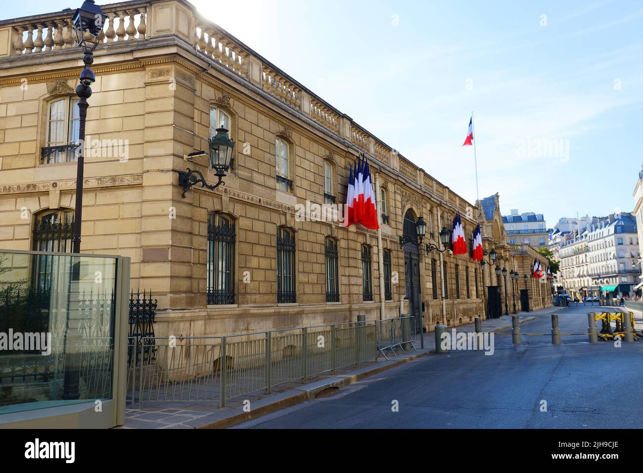 View of entrance gate of the Elysee Palace decorated with national ...