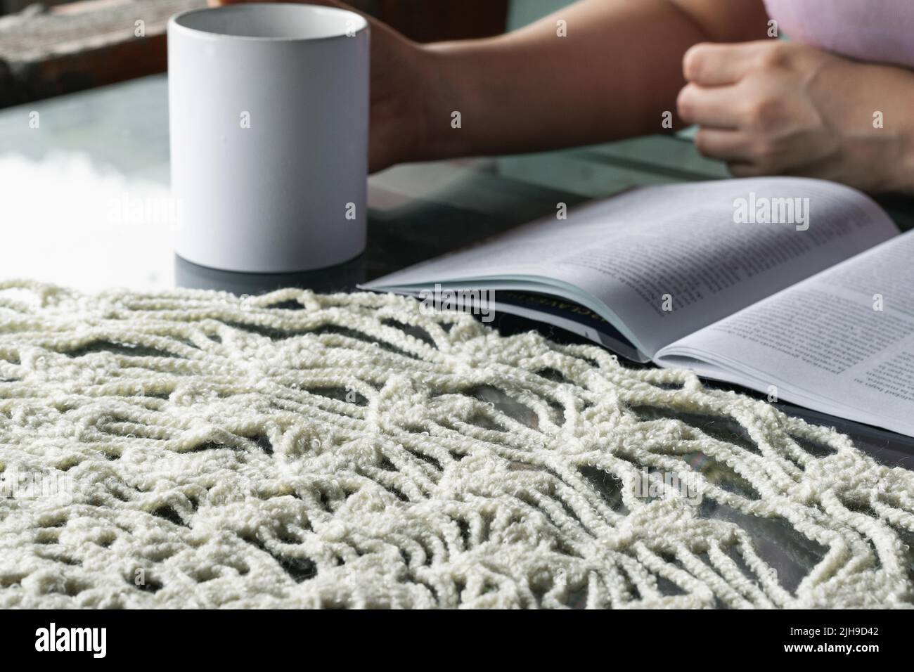 Young woman clutching book hi-res stock photography and images - Alamy