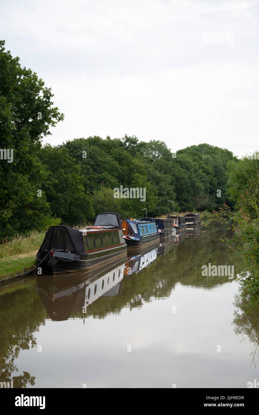 Narrow boats moored on the Middlewich branch of the Shropshire Union canal, Cheshire, NW UK ...