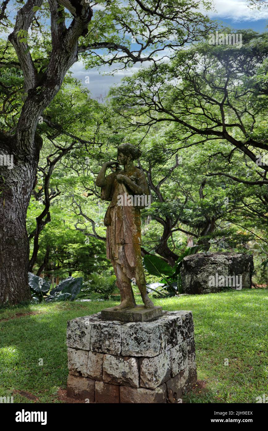 Stone statue of the Goddess Diana on a pedastal made of blocks of stone ...