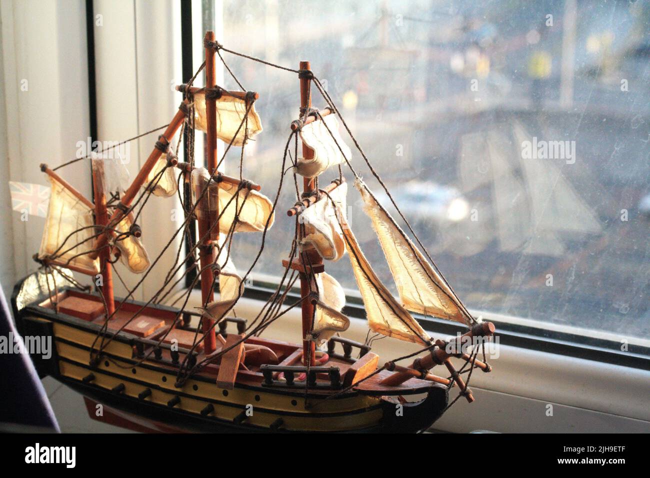 Model sail boat next to window in the morning Stock Photo - Alamy