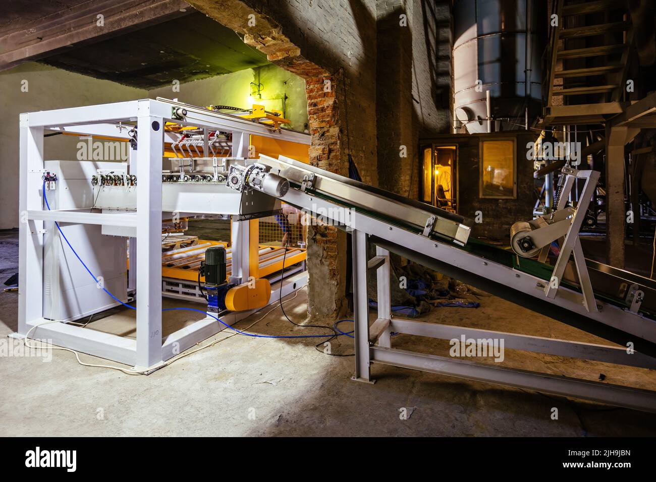 Cement packaging, bagging and stacking machine Stock Photo - Alamy