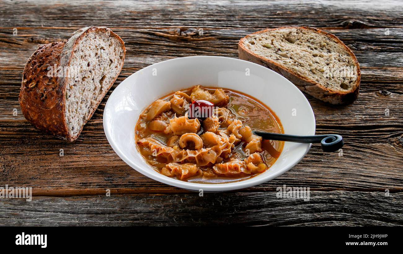 Beef tripe soup on wooden twblw top close up Stock Photo - Alamy
