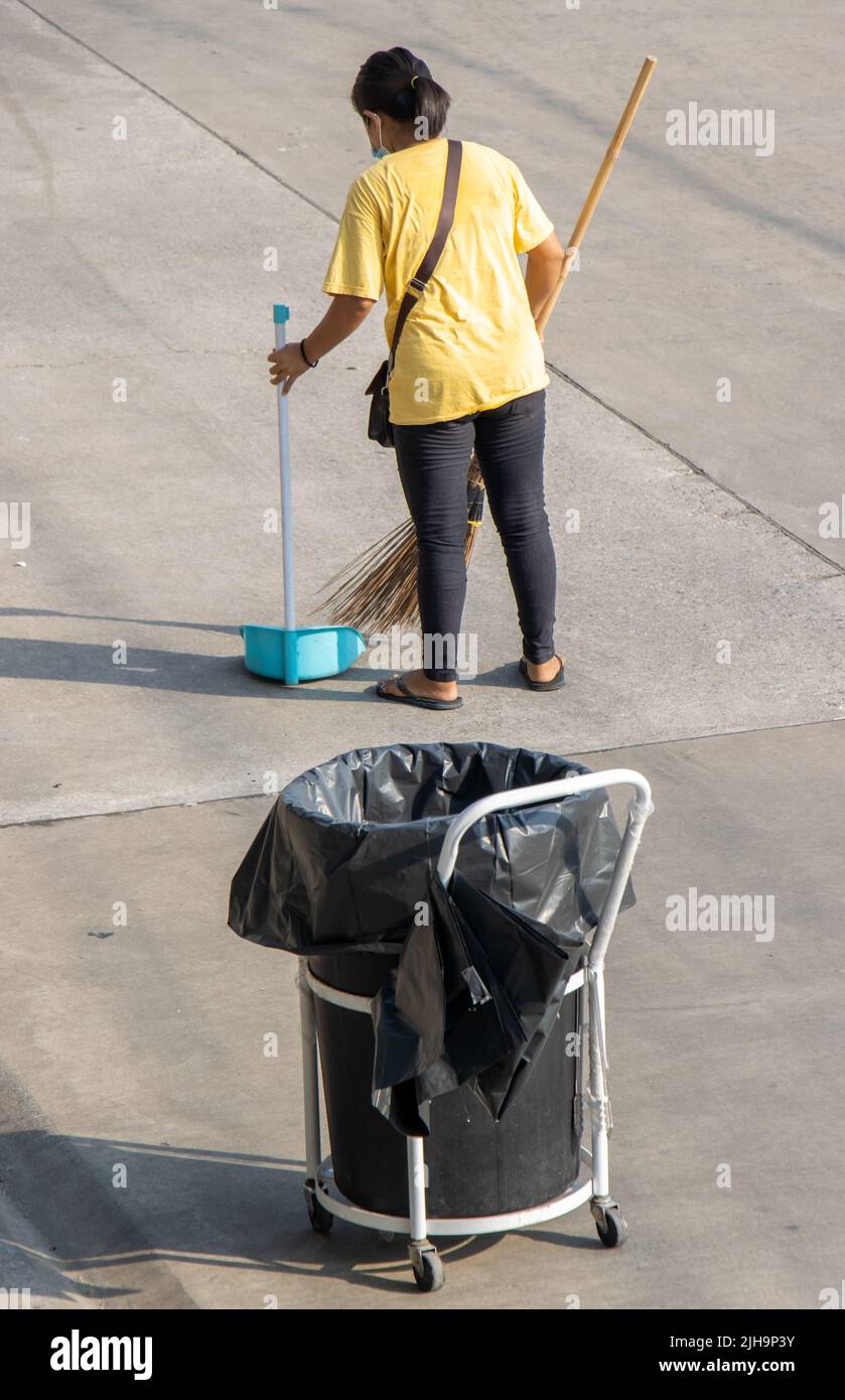 A woman sweeping street hi-res stock photography and images - Alamy