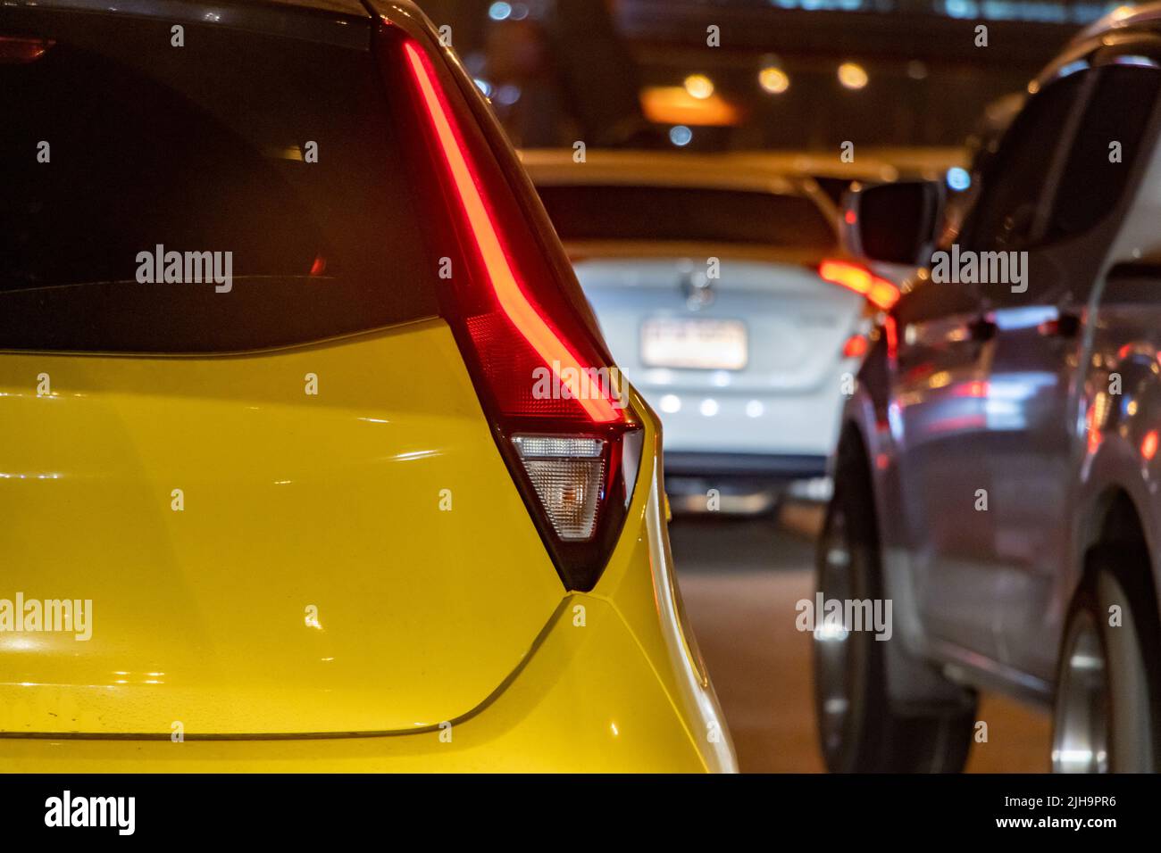 A tail-light of car at night city Stock Photo - Alamy