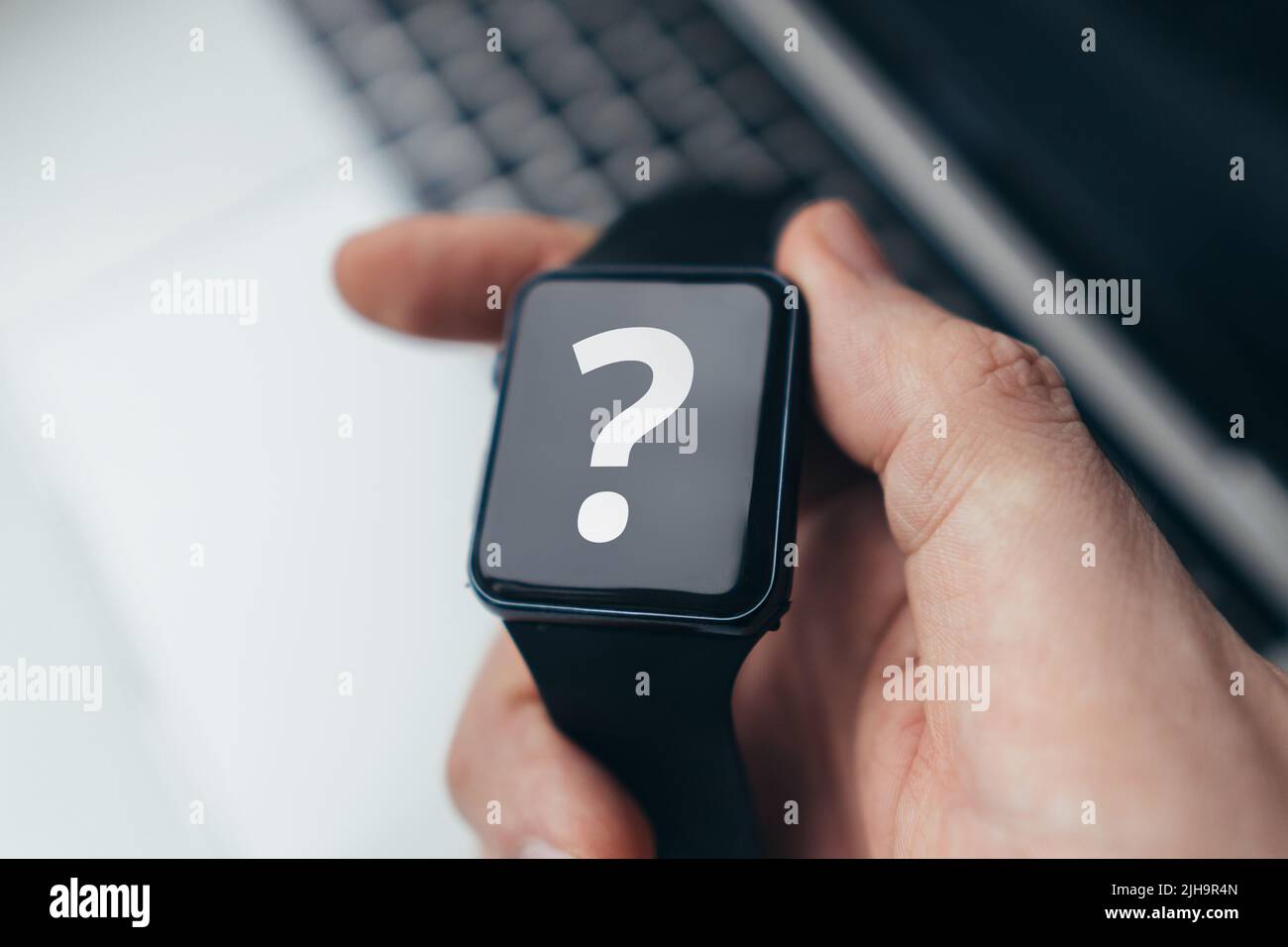 Question mark concept or FAQ. Sign on smart watch Stock Photo - Alamy