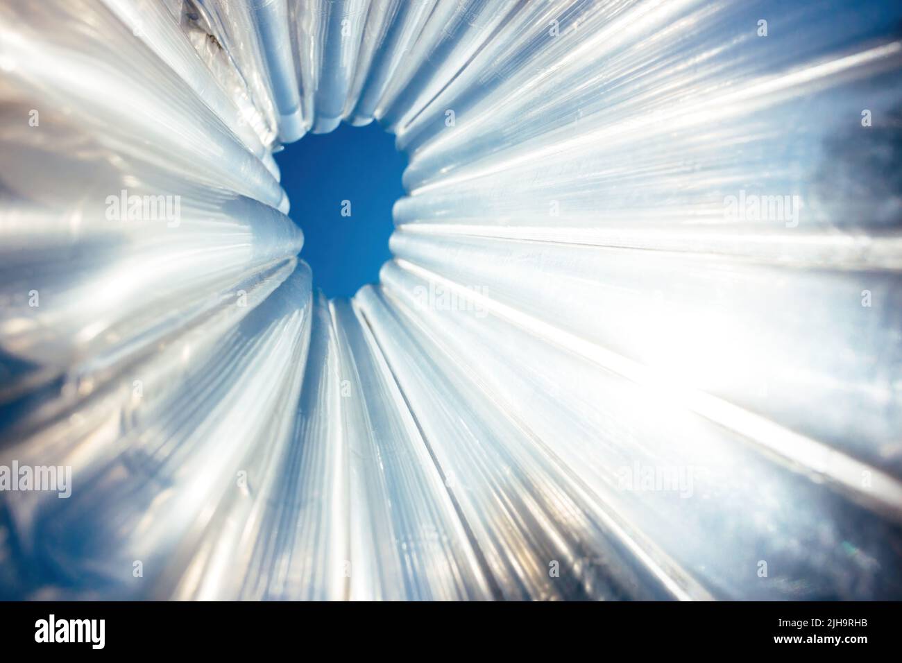 Clear sky view seen through plastic wrapping material - protecting the ...