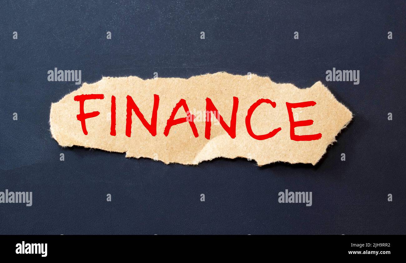 FINANCE word written on wood block, concept Stock Photo - Alamy