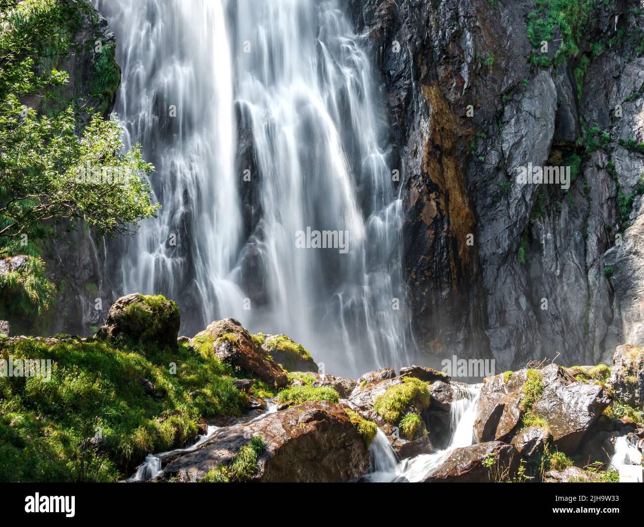 Falling water in a waterfall creates a cloud of water dust. Amazing ...