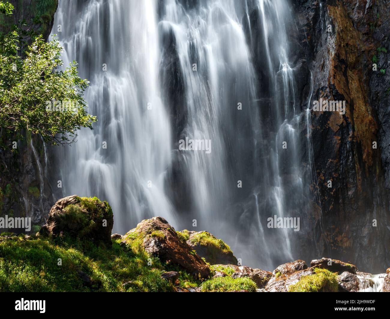 Falling water in a waterfall creates a cloud of water dust. Amazing ...