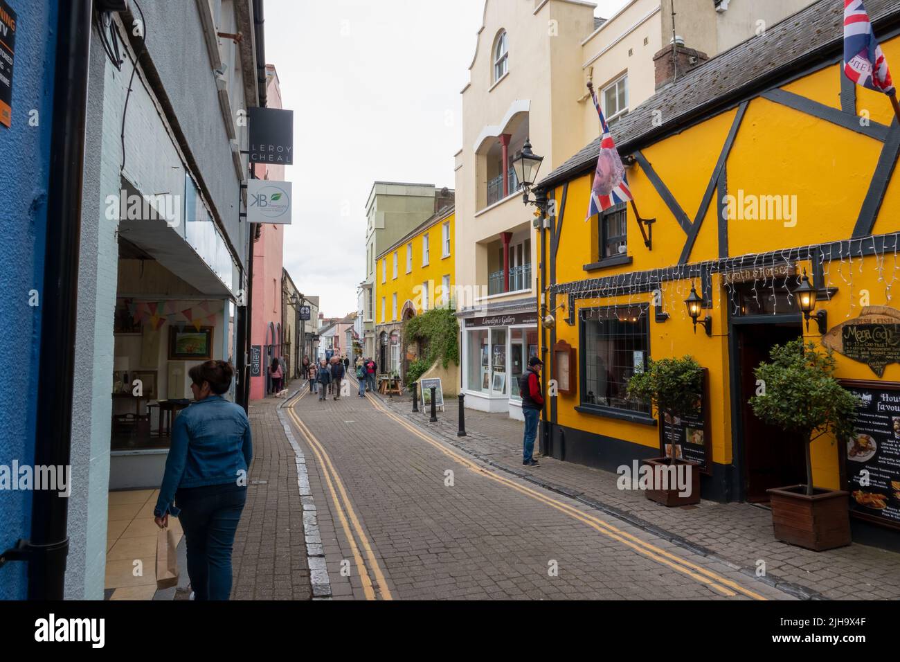 a view along Tenby High Street, a shopping venue with minimal traffic ...