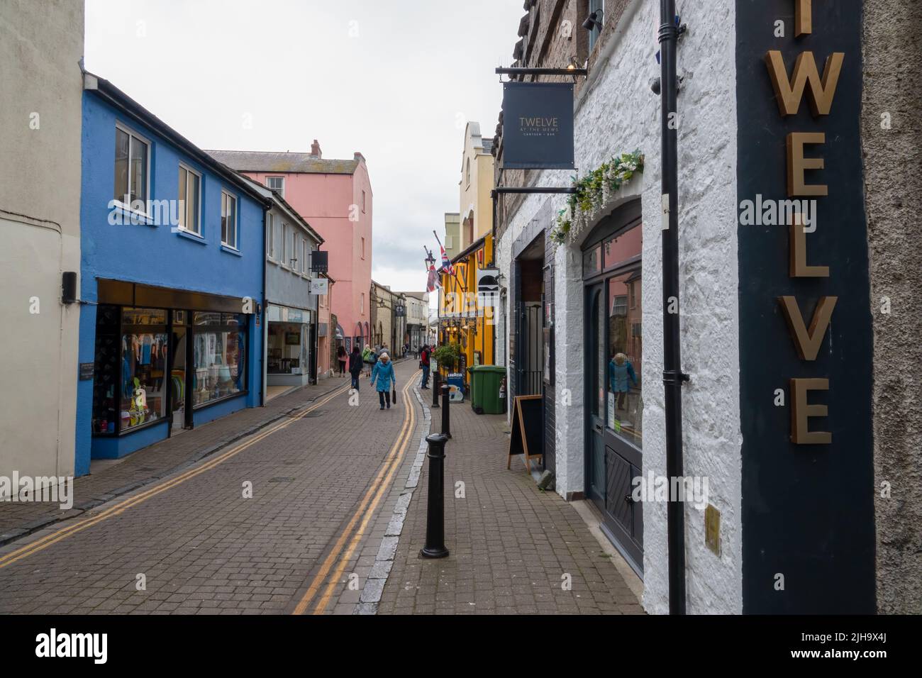 a view along Tenby High Street, a shopping venue with minimal traffic ...