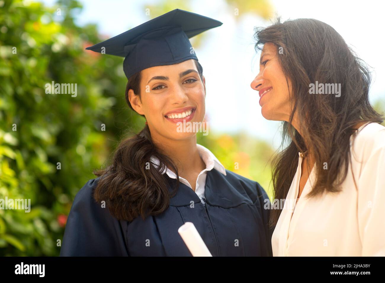 Mother hugging her daugher at her graduation Stock Photo - Alamy