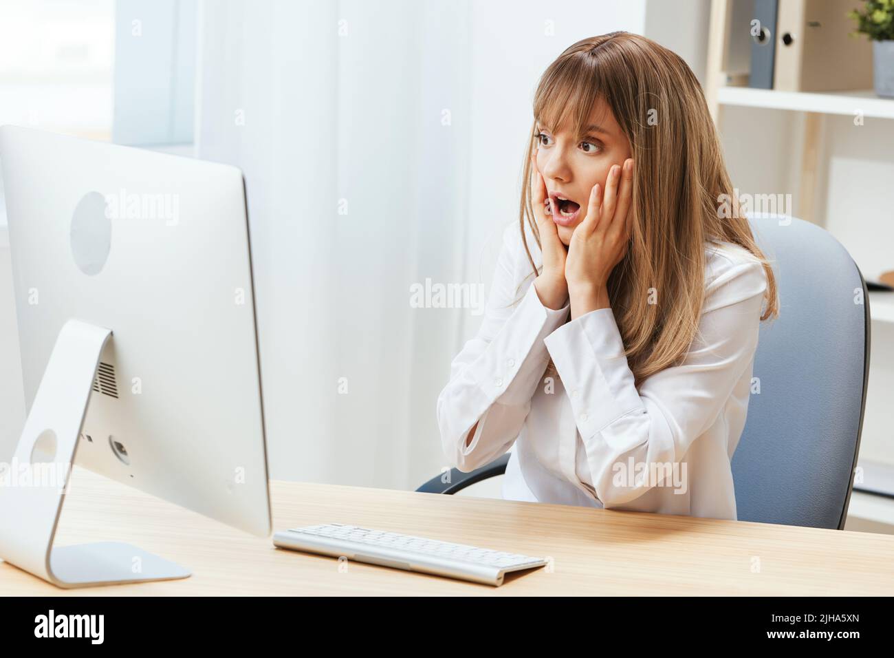 Shocked upset adorable blonde businesswoman worker touch chin both ...
