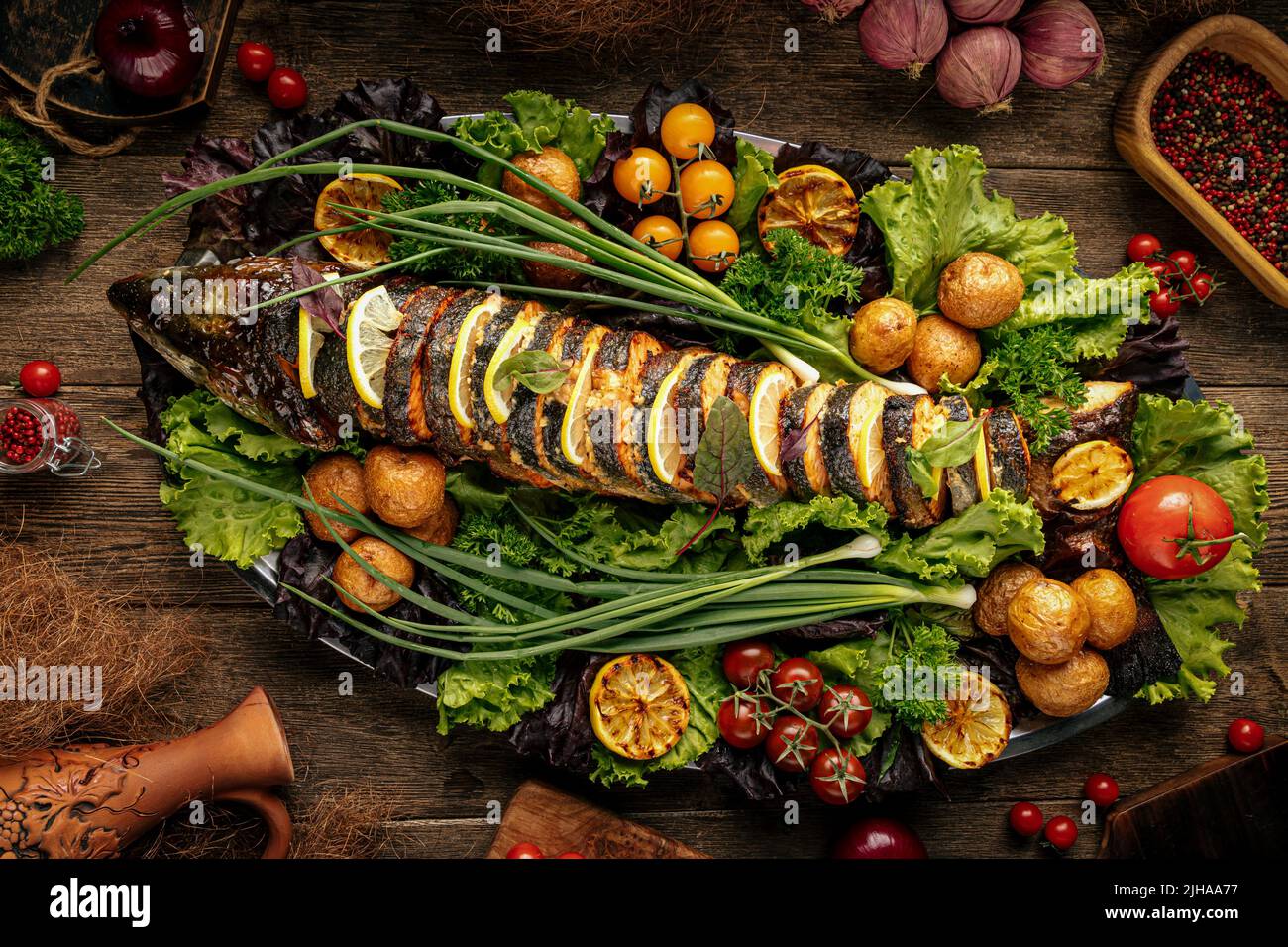 Gourmet grilled sliced fish banquet dish Stock Photo - Alamy