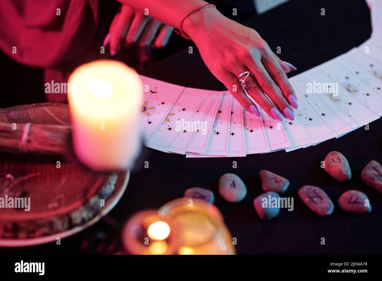 Closeup image of fortune teller predicting fate with tarot cards in ...