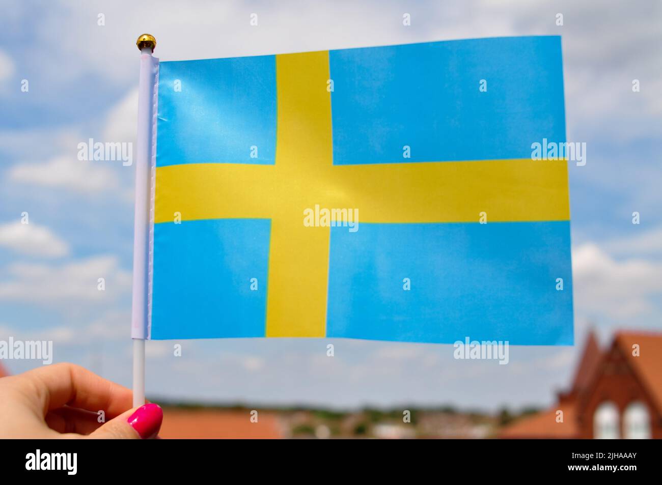 the national blue and yellow flag of sweden close up Stock Photo - Alamy