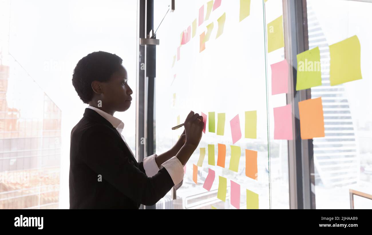 Young African American manager woman planning business work process ...
