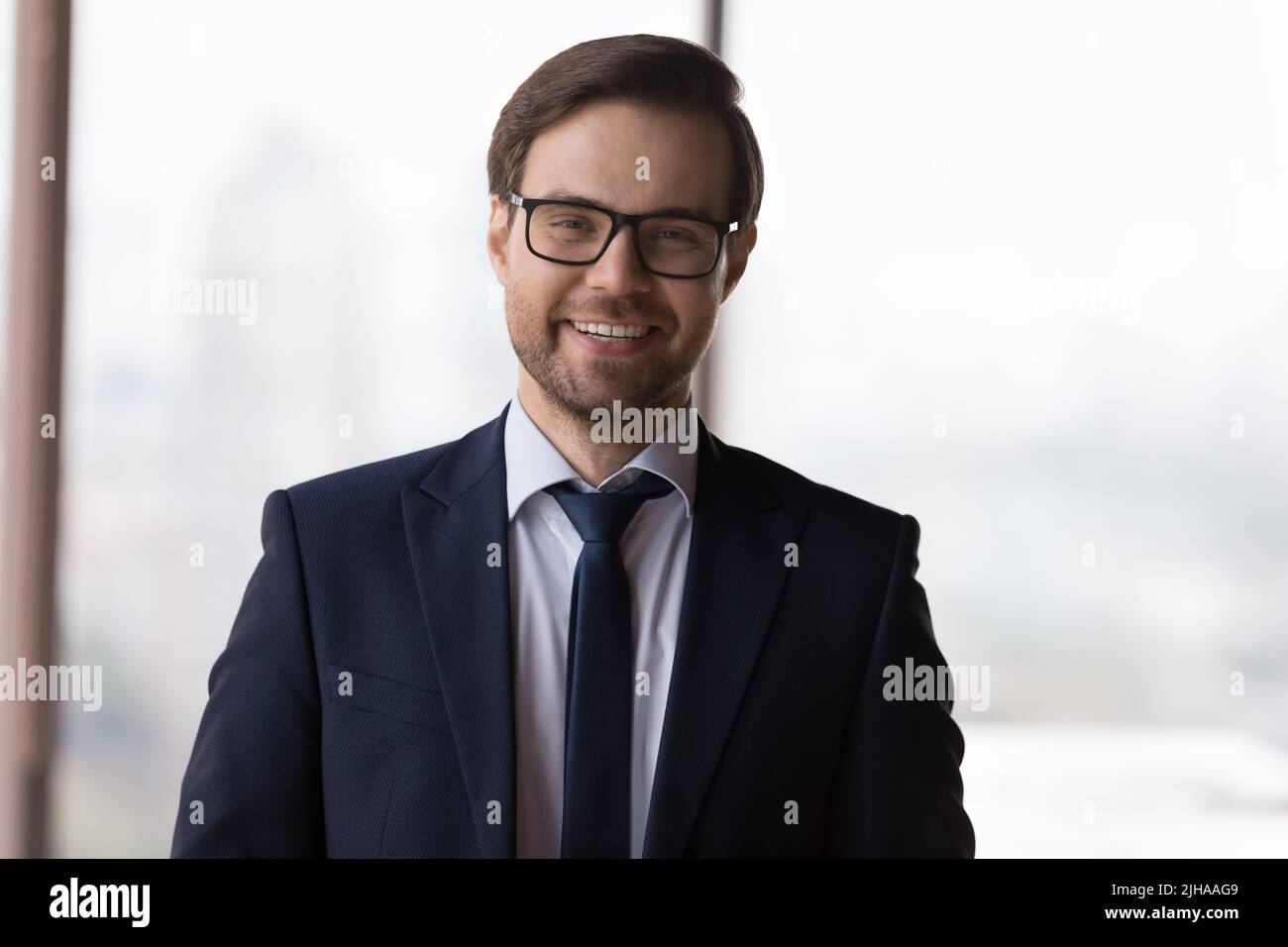 Happy successful business leader in glasses head shot Stock Photo - Alamy