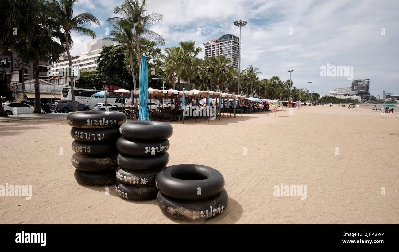 Tubes on Pattaya Beach on Beach Road Pattaya Thailand Stock Photo - Alamy