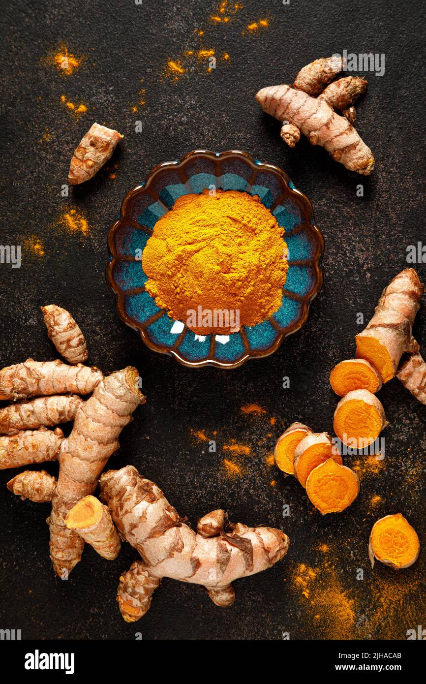 Turmeric. Fresh turmeric root and turmeric, curcumin powder Stock Photo ...