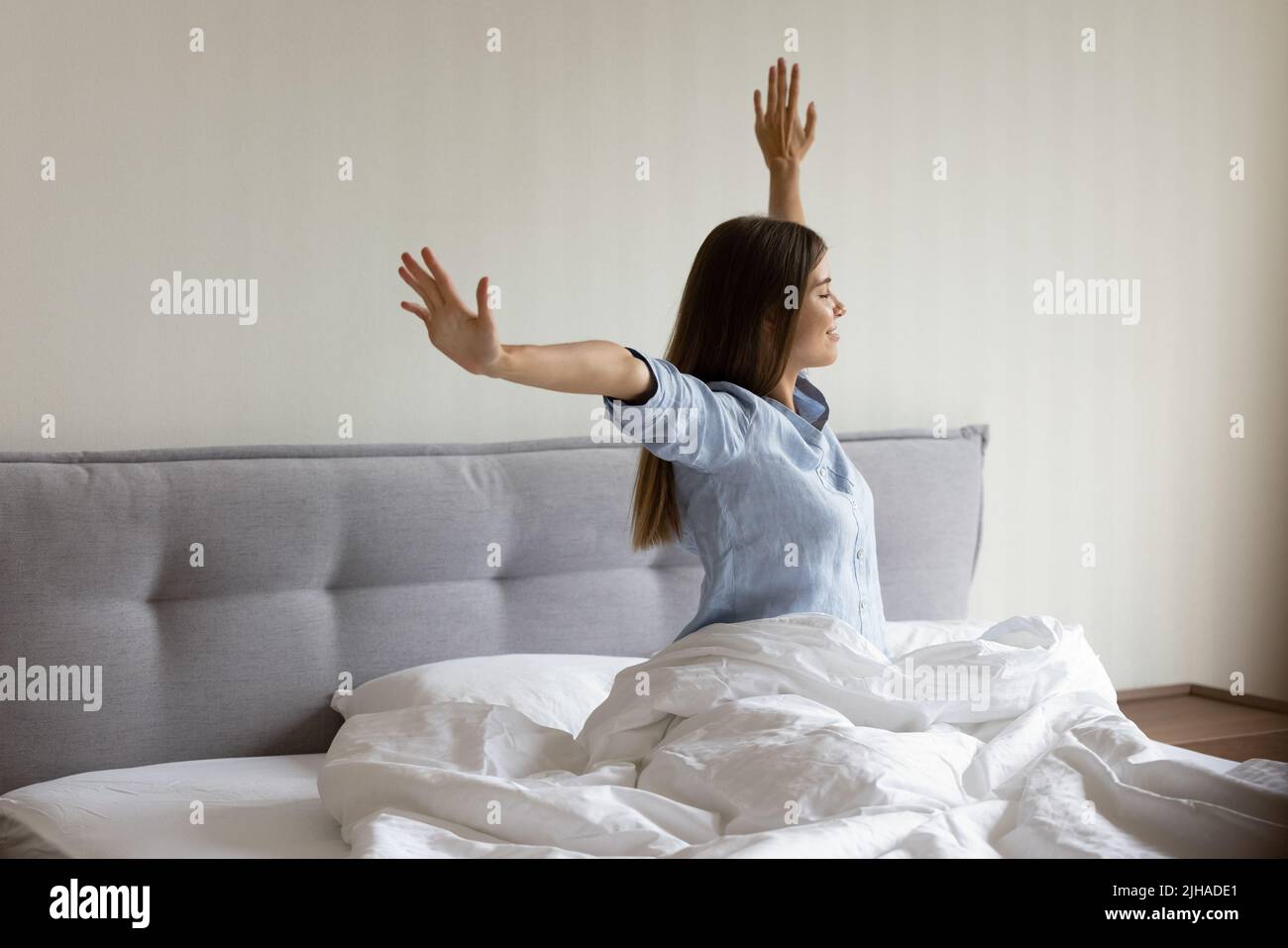 Rested after night sleep woman do stretching exercises in bed Stock ...