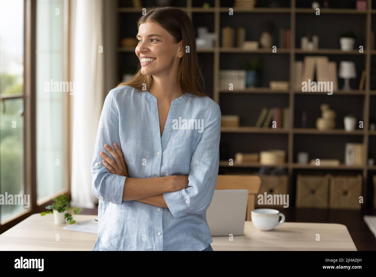 Beautiful woman pose in modern office smile look into distance Stock ...
