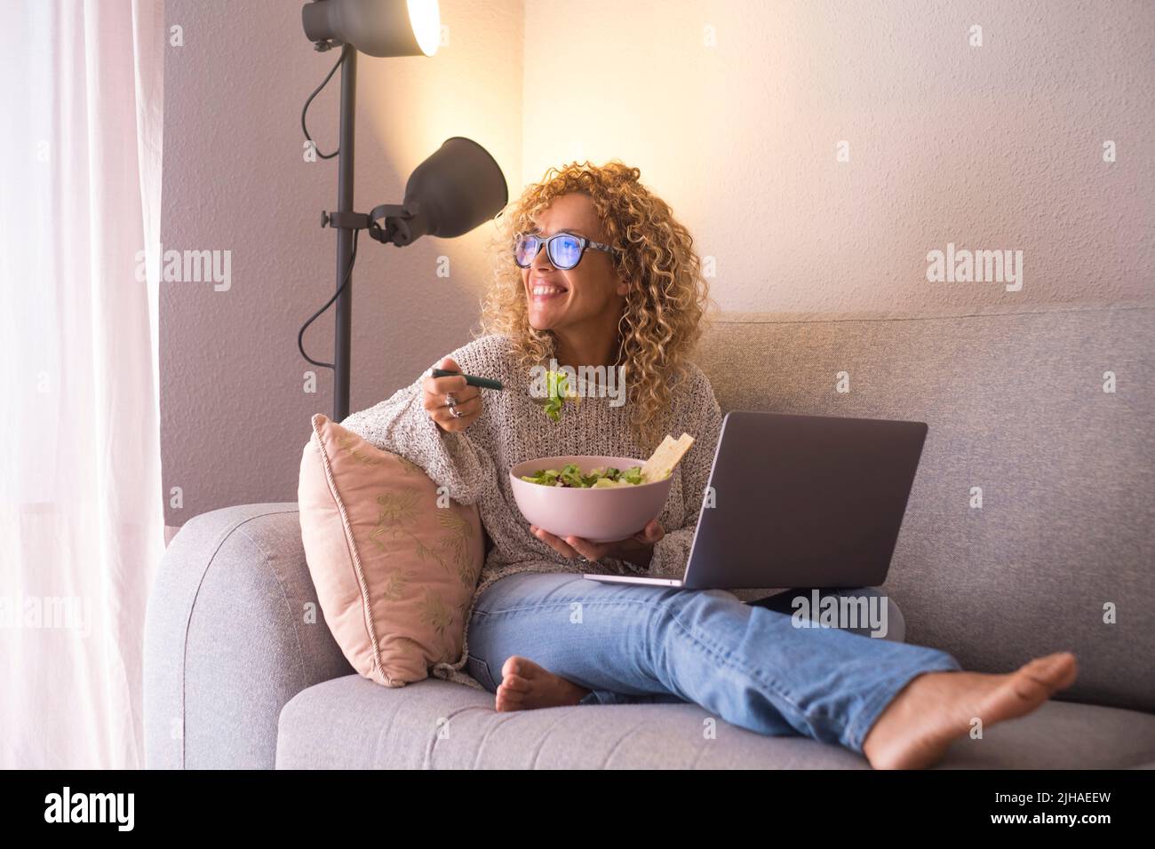 One woman at home have relax leisure activity eating healthy salad and ...