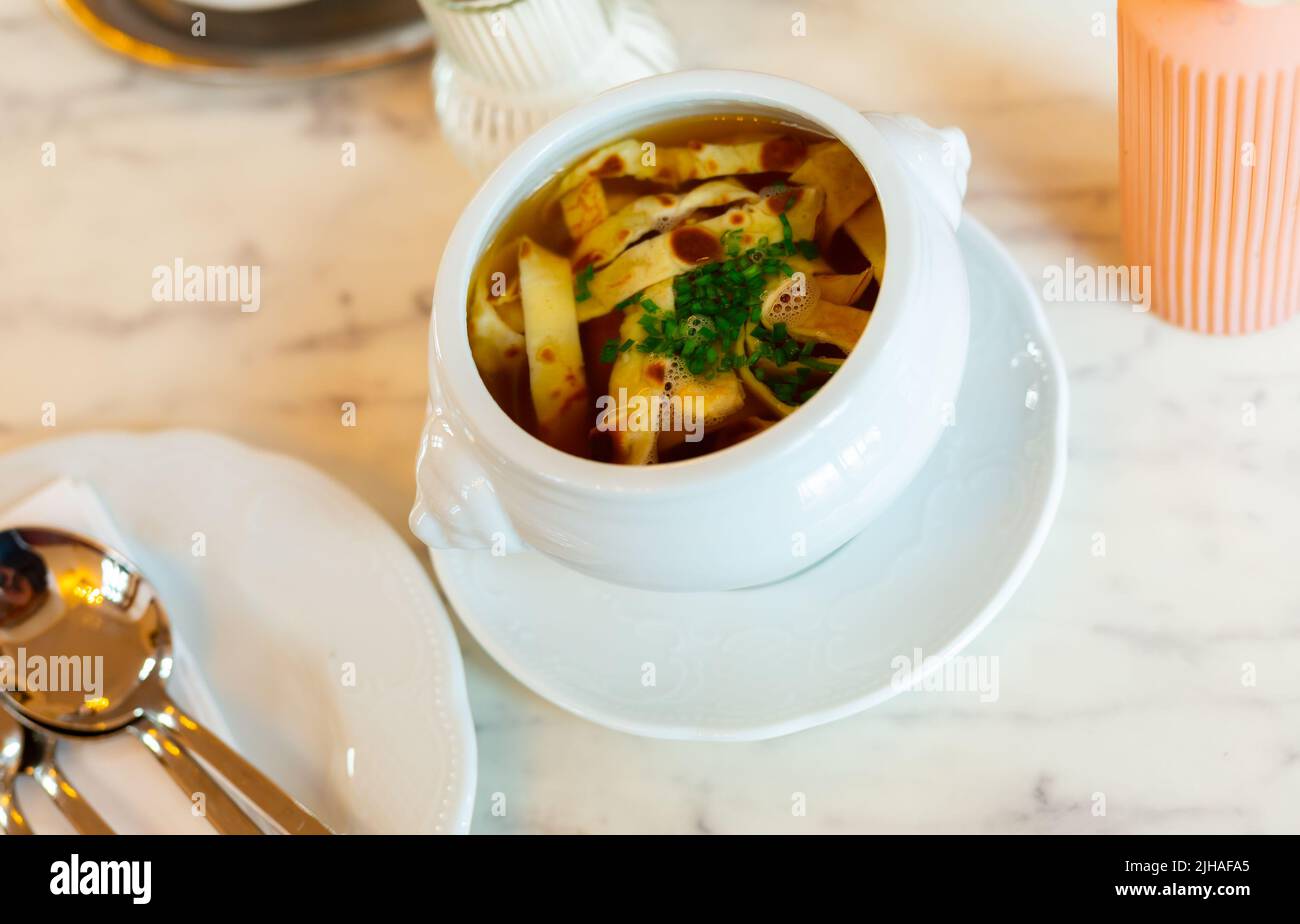 Dish of Austrian cuisine is beef soup with fried strips of pancakes ...