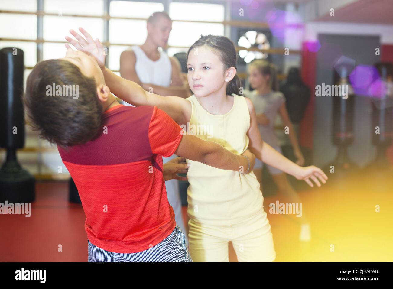 Children practicing self defence technique in pairs Stock Photo - Alamy