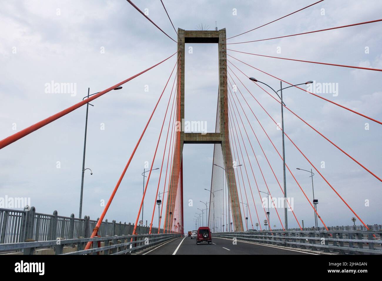 Scene of the famous Suramadu Bridge and its red suspension steel cables ...
