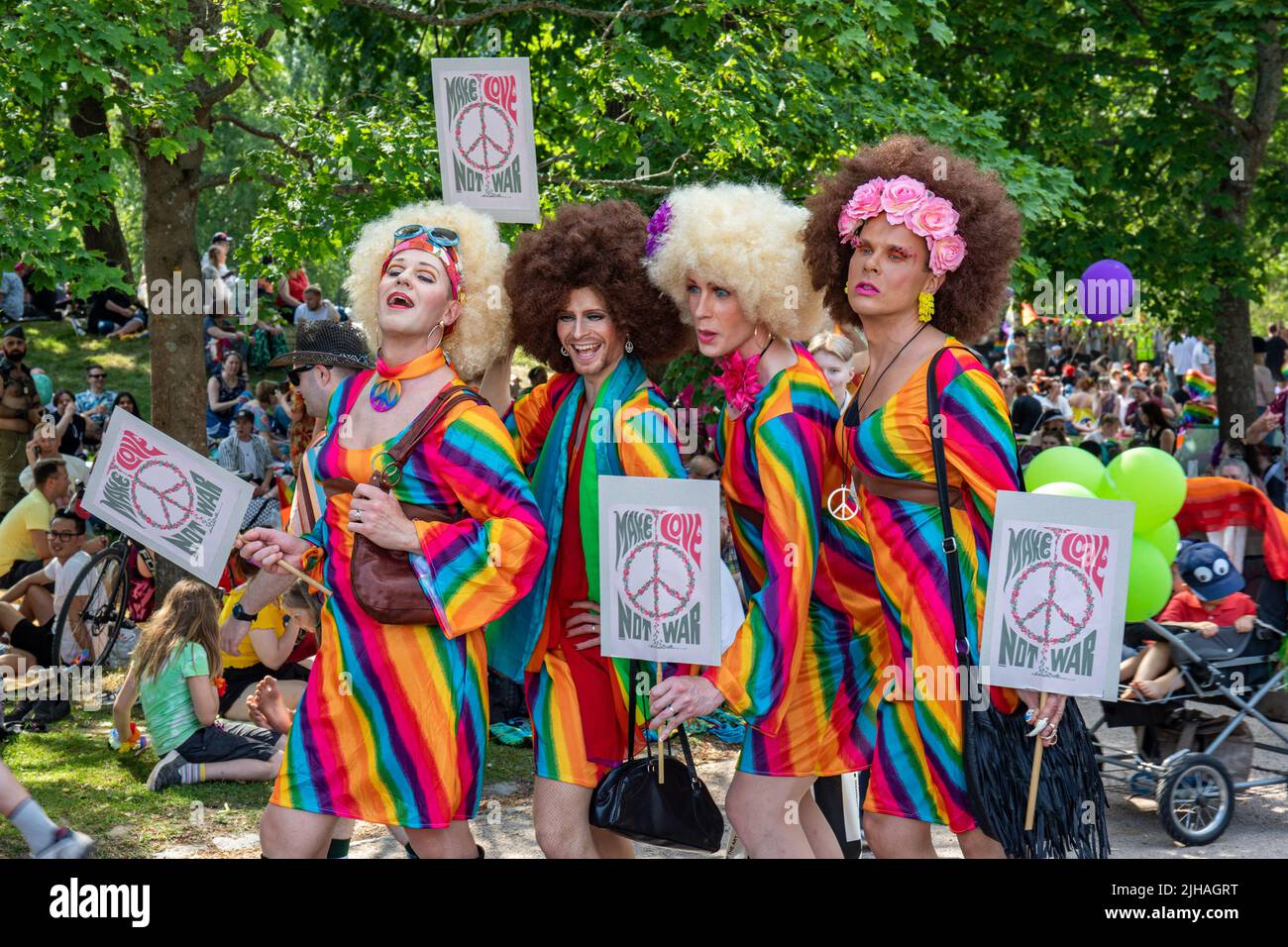 Drag queens posing with Make Love Not War signs at Helsinki Pride Park ...