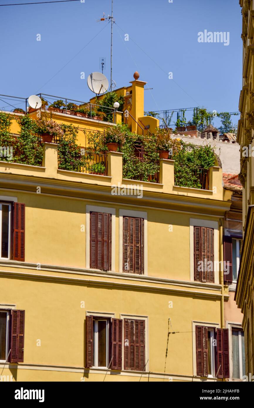 A vertical shot of a classic Italian residential building against the ...