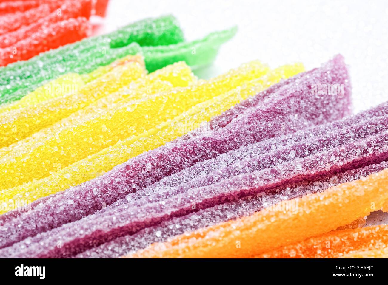 Colorful sugar jelly candy strip over white background Stock Photo - Alamy