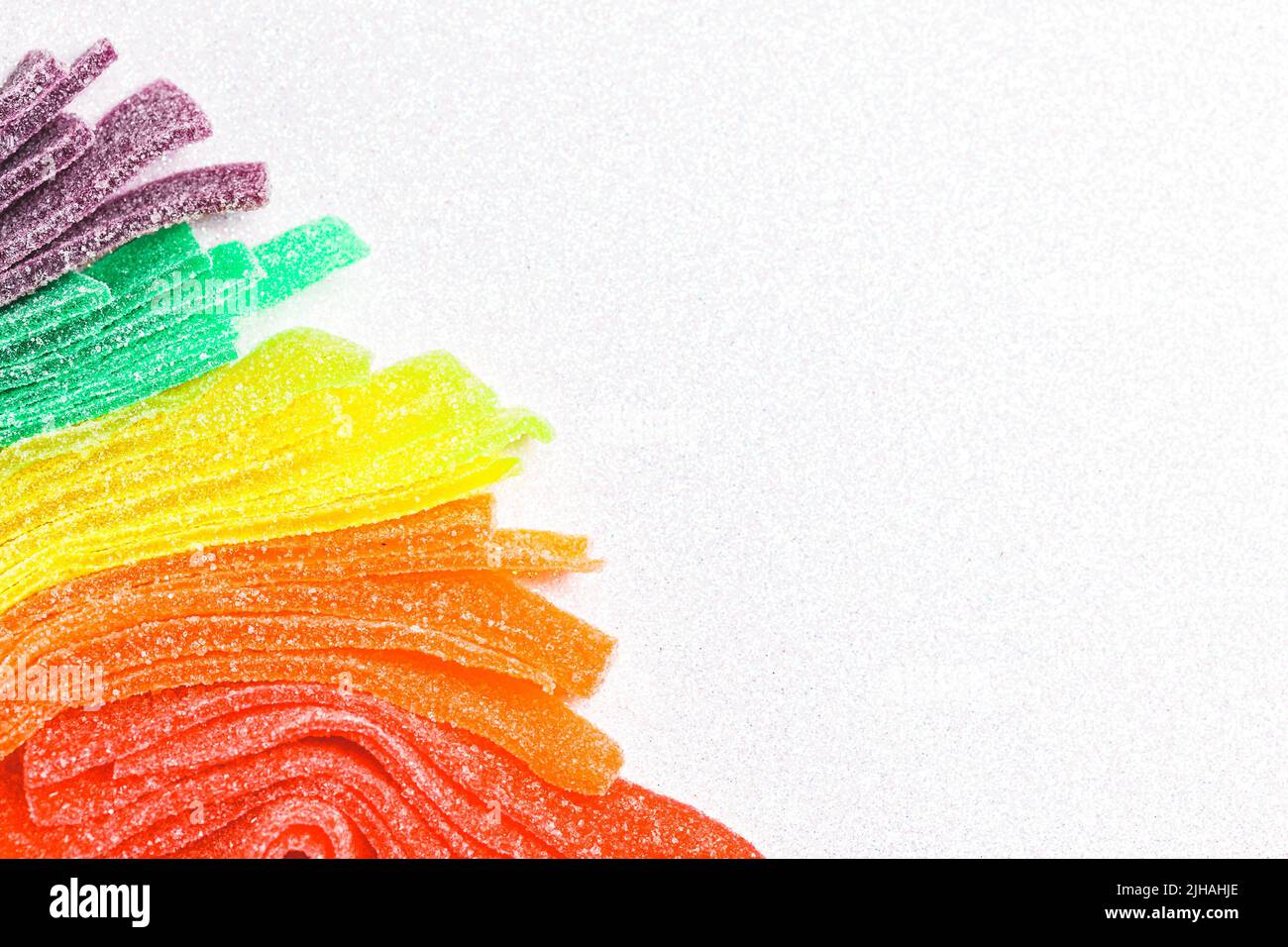 Colorful sugar jelly candy strip over white background Stock Photo - Alamy