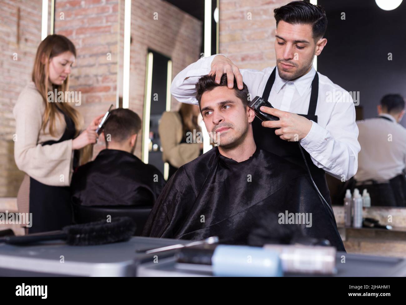 Barber making modern male hi-res stock photography and images - Alamy