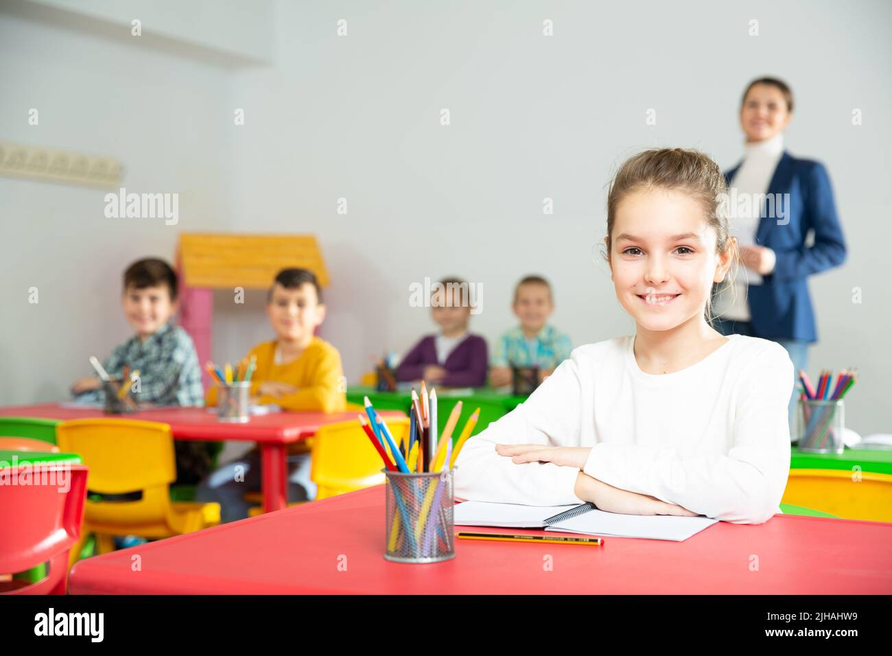 Intelligent girl at school desk Stock Photo - Alamy