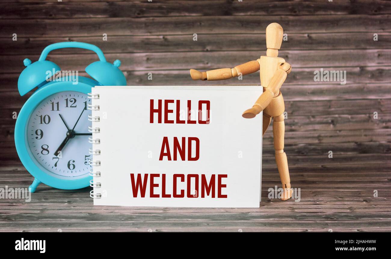 Wooden working office, welcome text and greeting on notepad Stock Photo ...