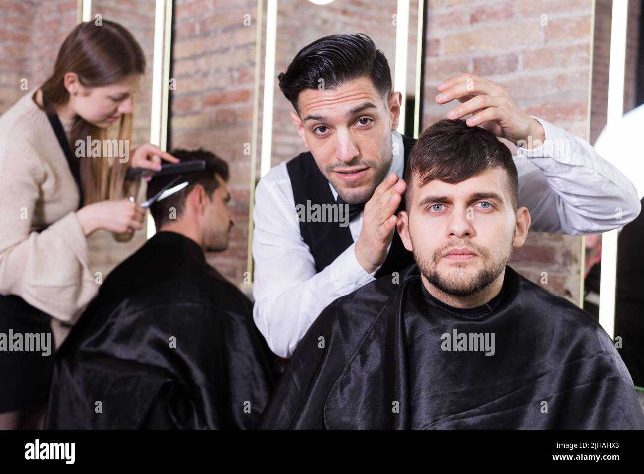Hairdresser client discussing hi-res stock photography and images - Alamy