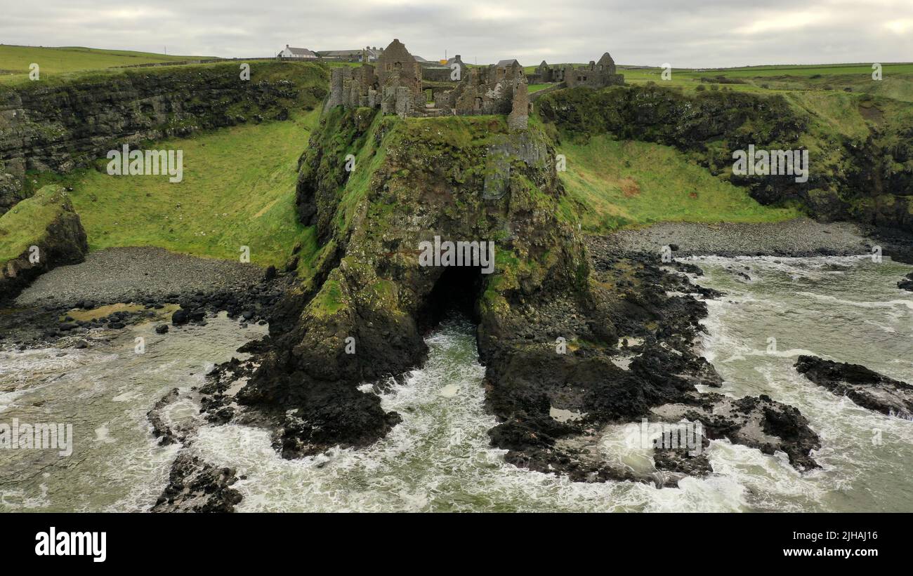 An aerial view of a rocky green cliff with ancient ruins in Northern ...