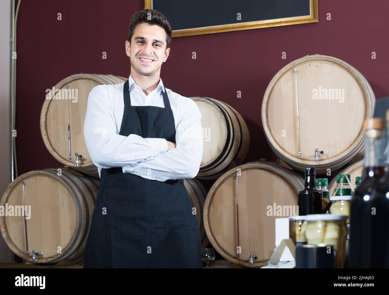 man in uniform standing in store wine section with woods Stock Photo ...
